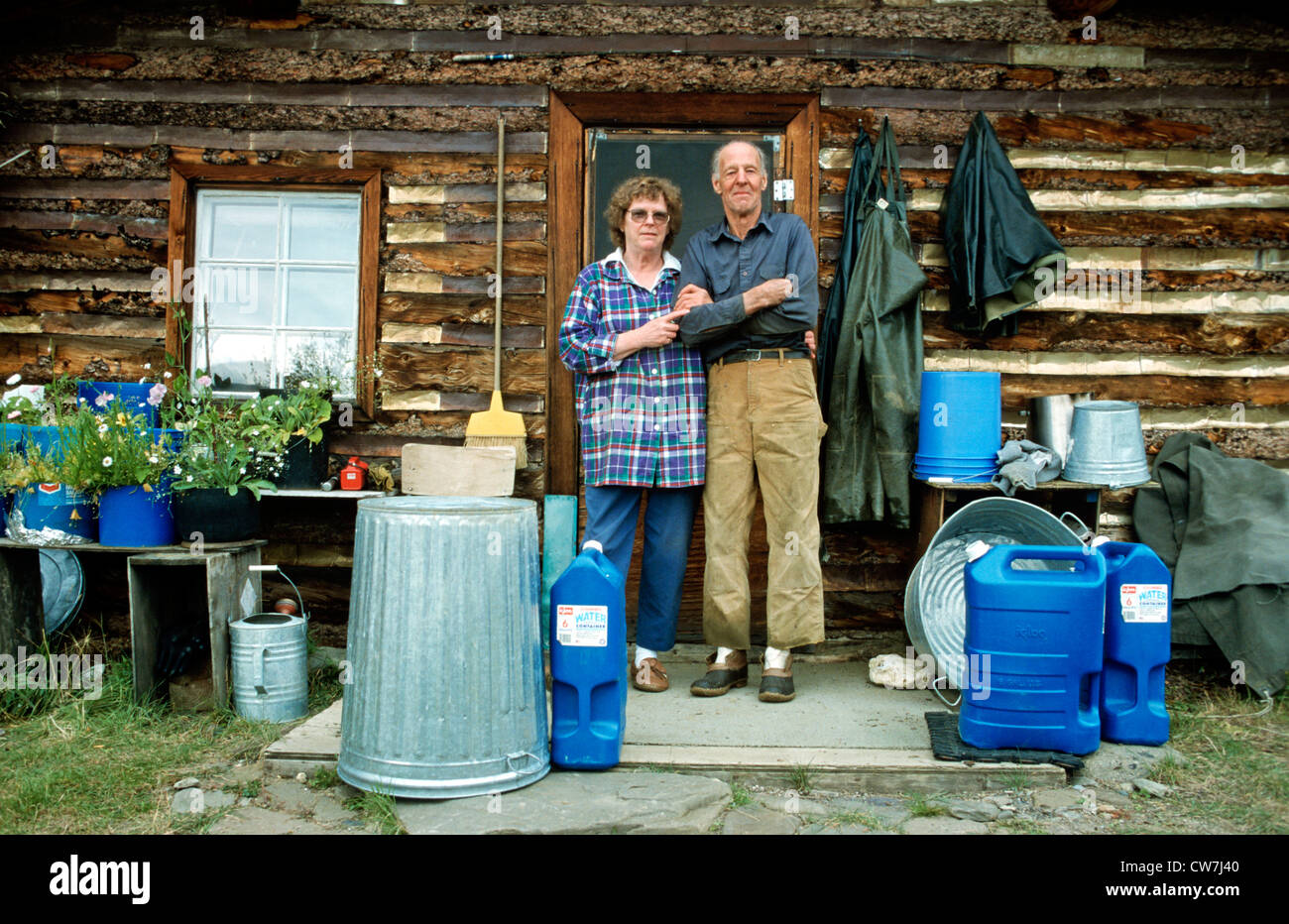 old gold-digger couple in front of their cabin at Brooks Range, USA ...