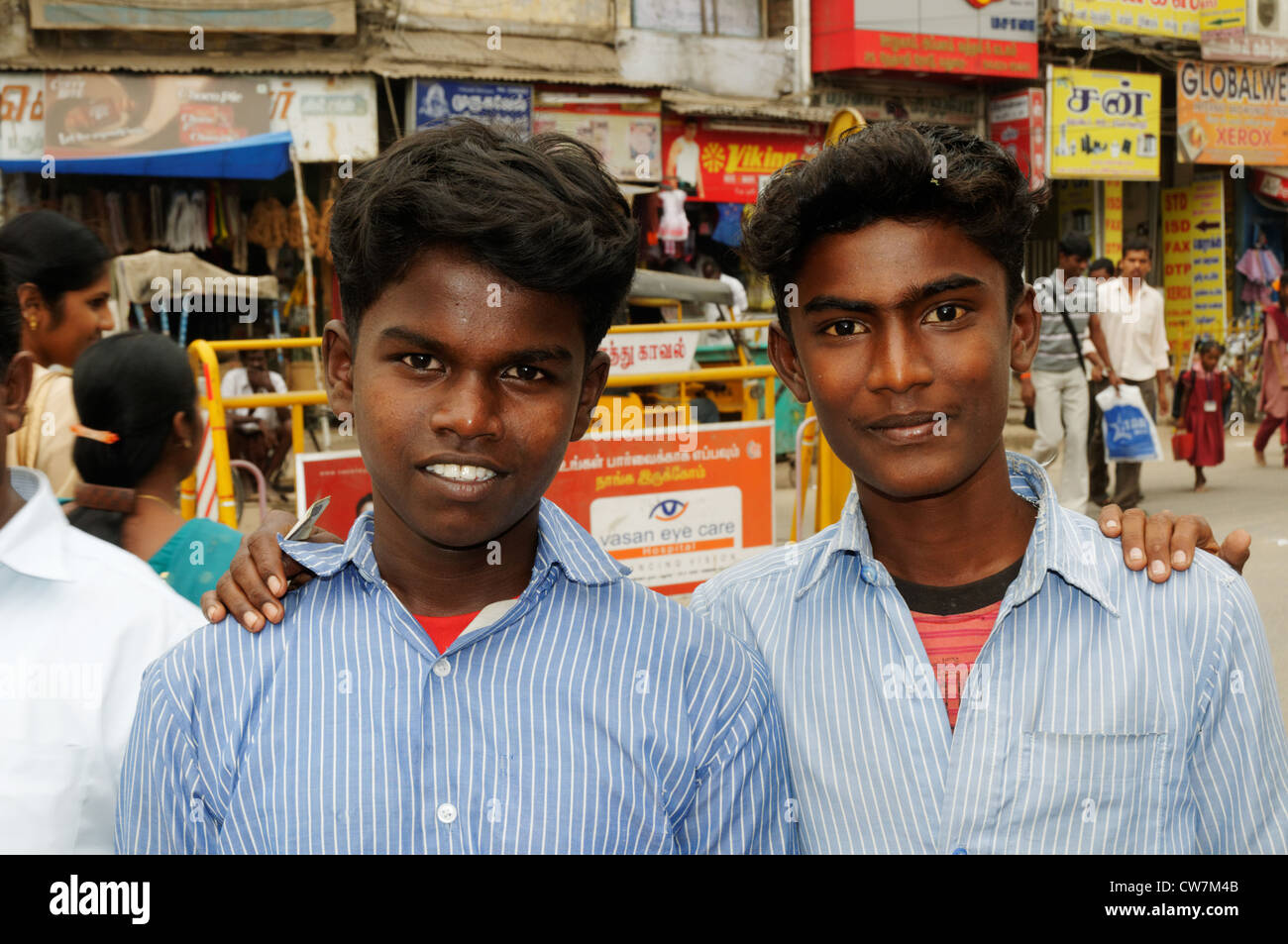 Two young Indian men pose for the camera Stock Photo - Alamy