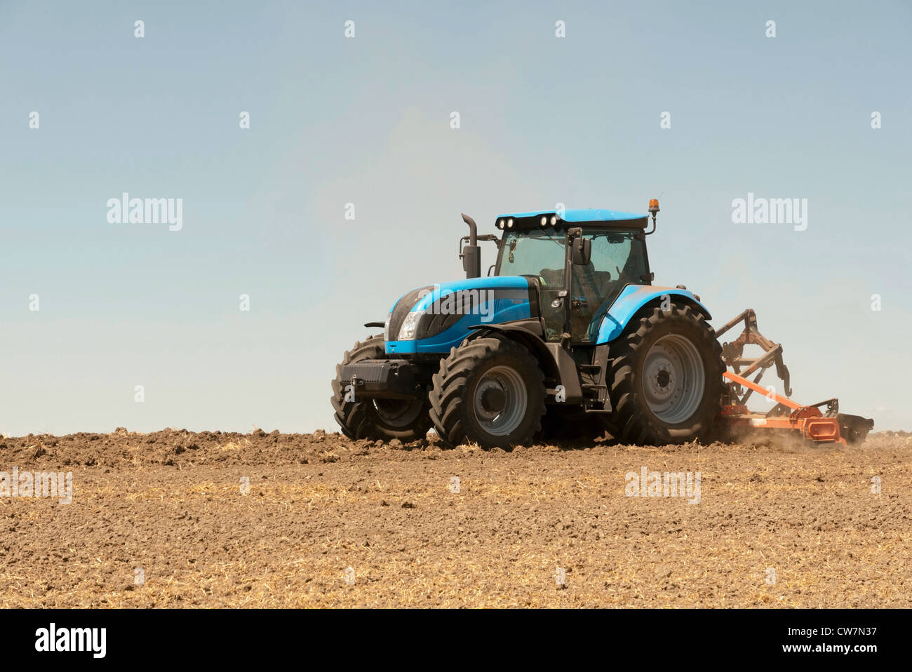 Agricultural activities, farm equipment in field Stock Photo - Alamy