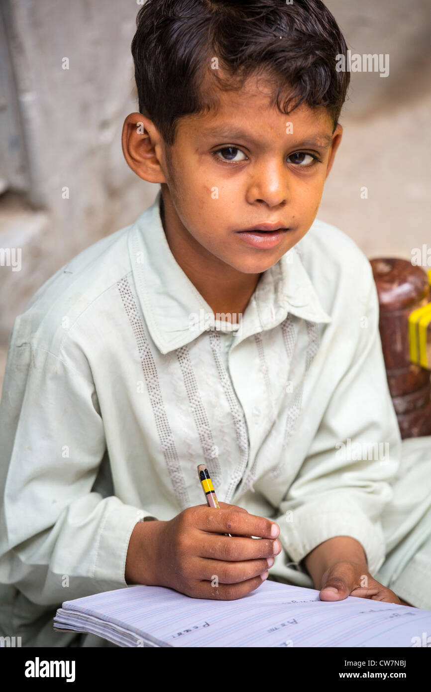 Young Pakistani boy writing english in Said Pur Village, Islamabad ...