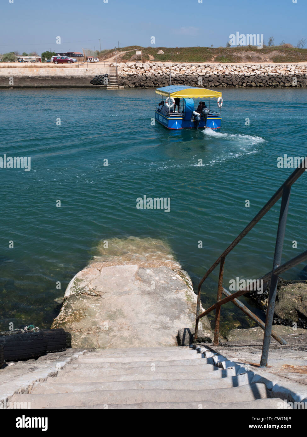 The passenger ferry between Lagos town and Meia Praia beach Stock Photo ...