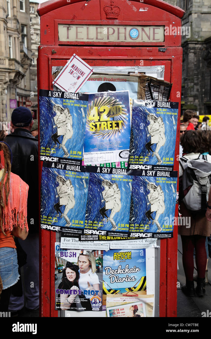 Posters on a telephone box in Edinburgh advertising shows at the ...