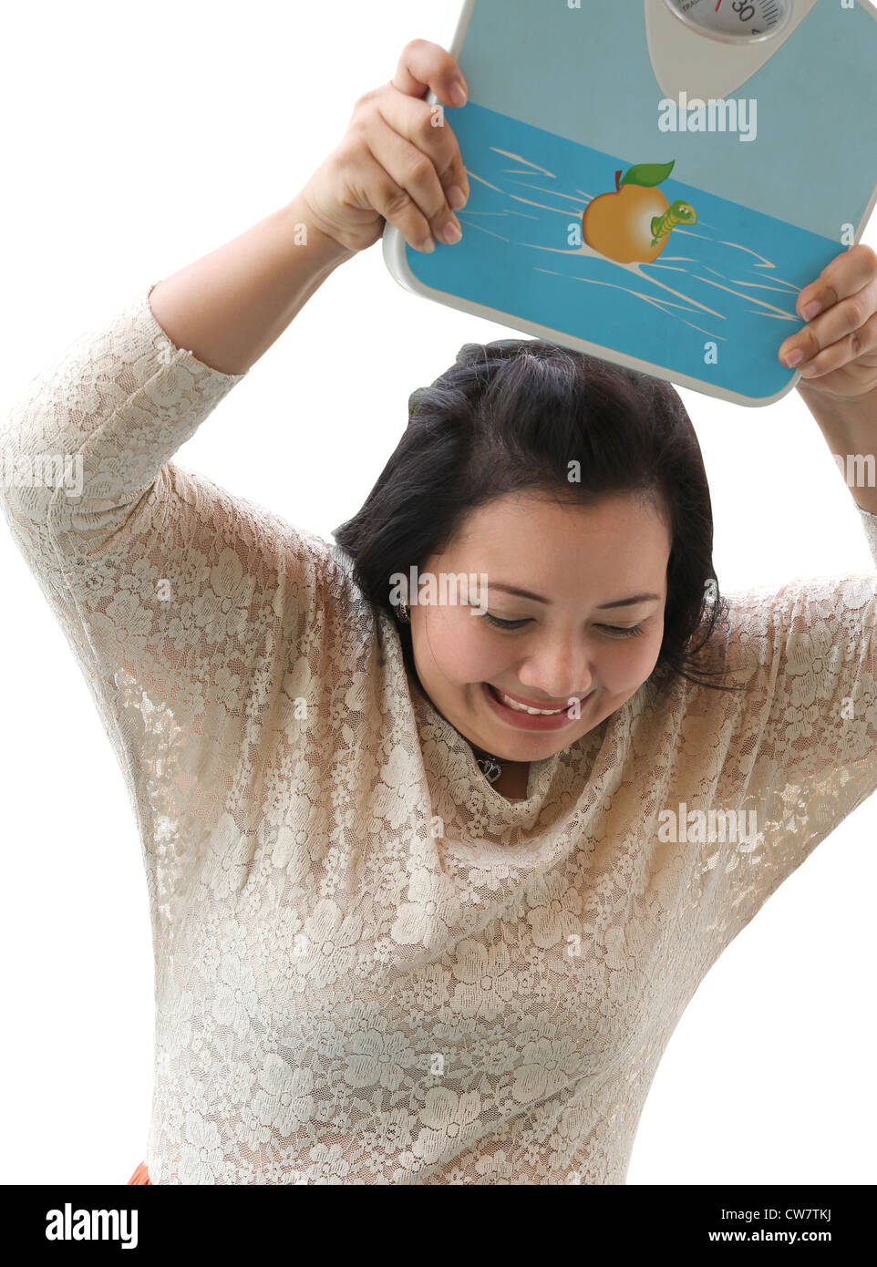 Image of angry woman holding weight scale over her head Stock Photo - Alamy