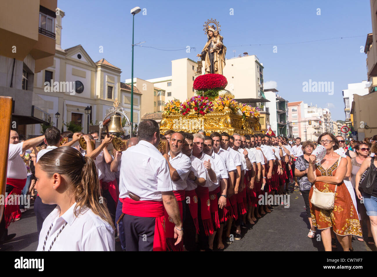 Worshipers carrying a religious image during a procession Stock Photo ...