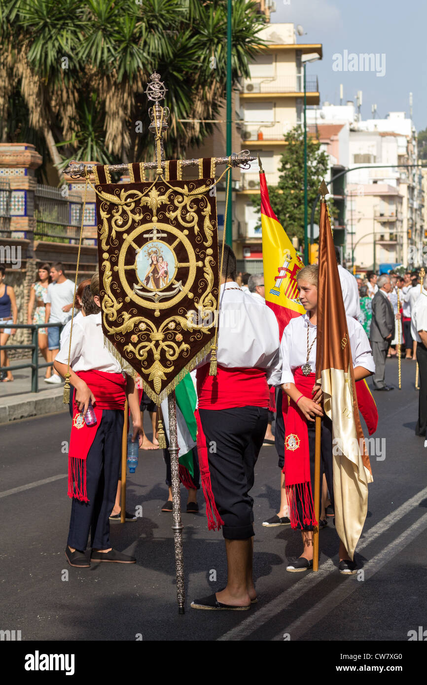 Worshiper with a religious banner in a procession Stock Photo - Alamy