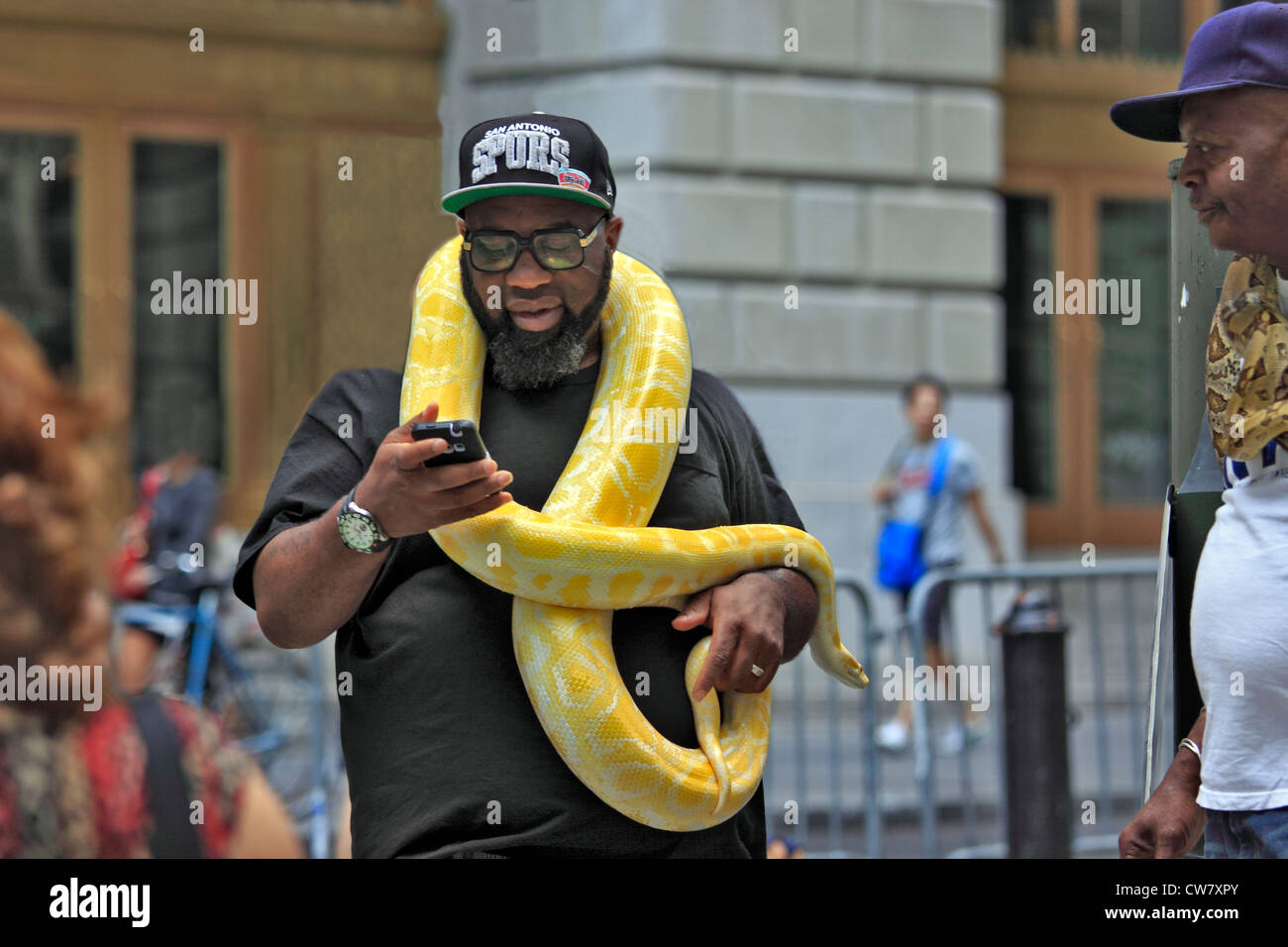 Man with snake making mobile phone call lower Manhattan new York City ...
