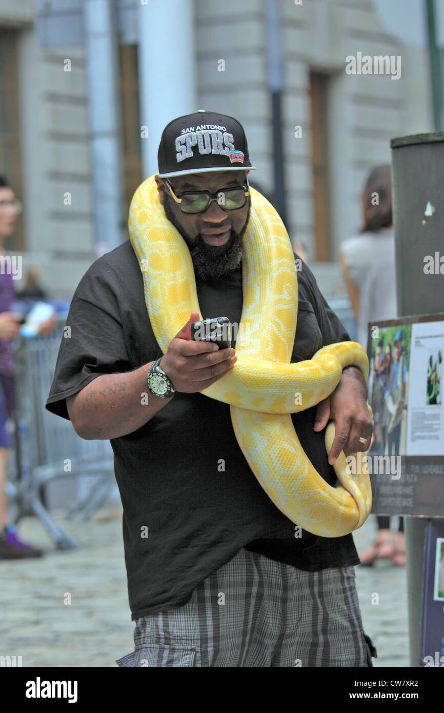 Man with snake making mobile phone call lower Manhattan New York City ...