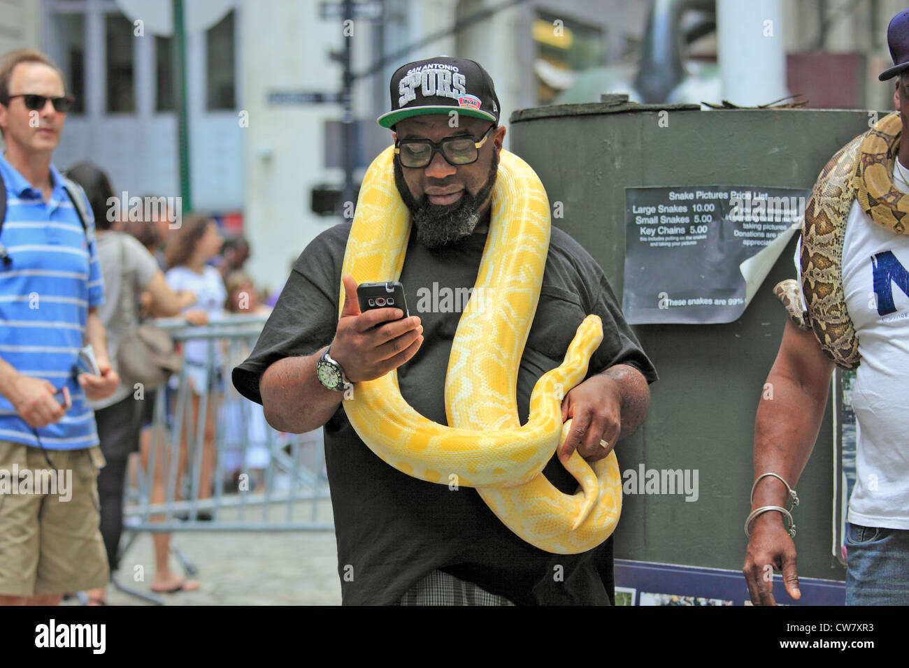 Man with snake making mobile phone call lower Manhattan New York City ...