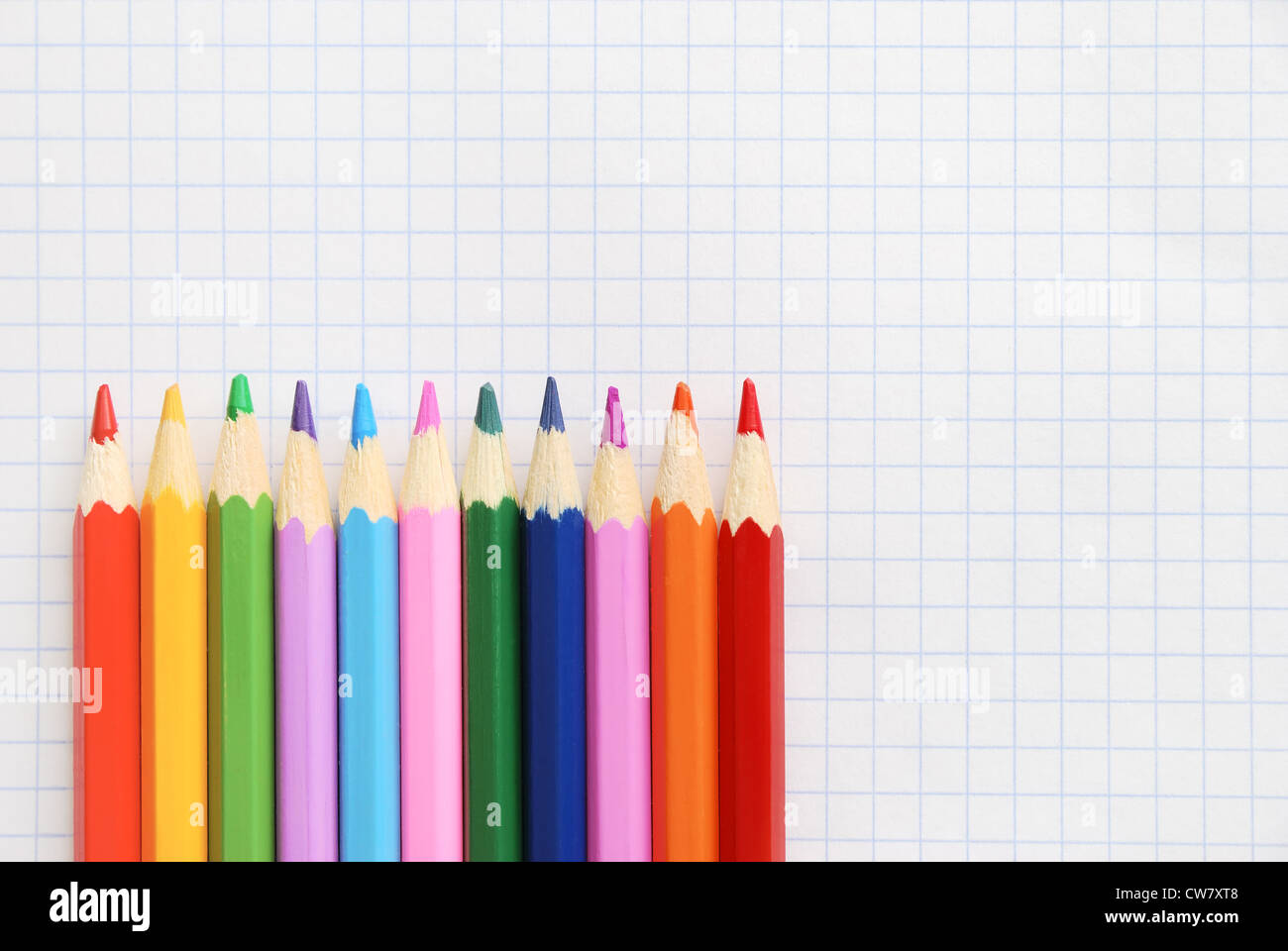 Colored pencils on squared paper Stock Photo - Alamy