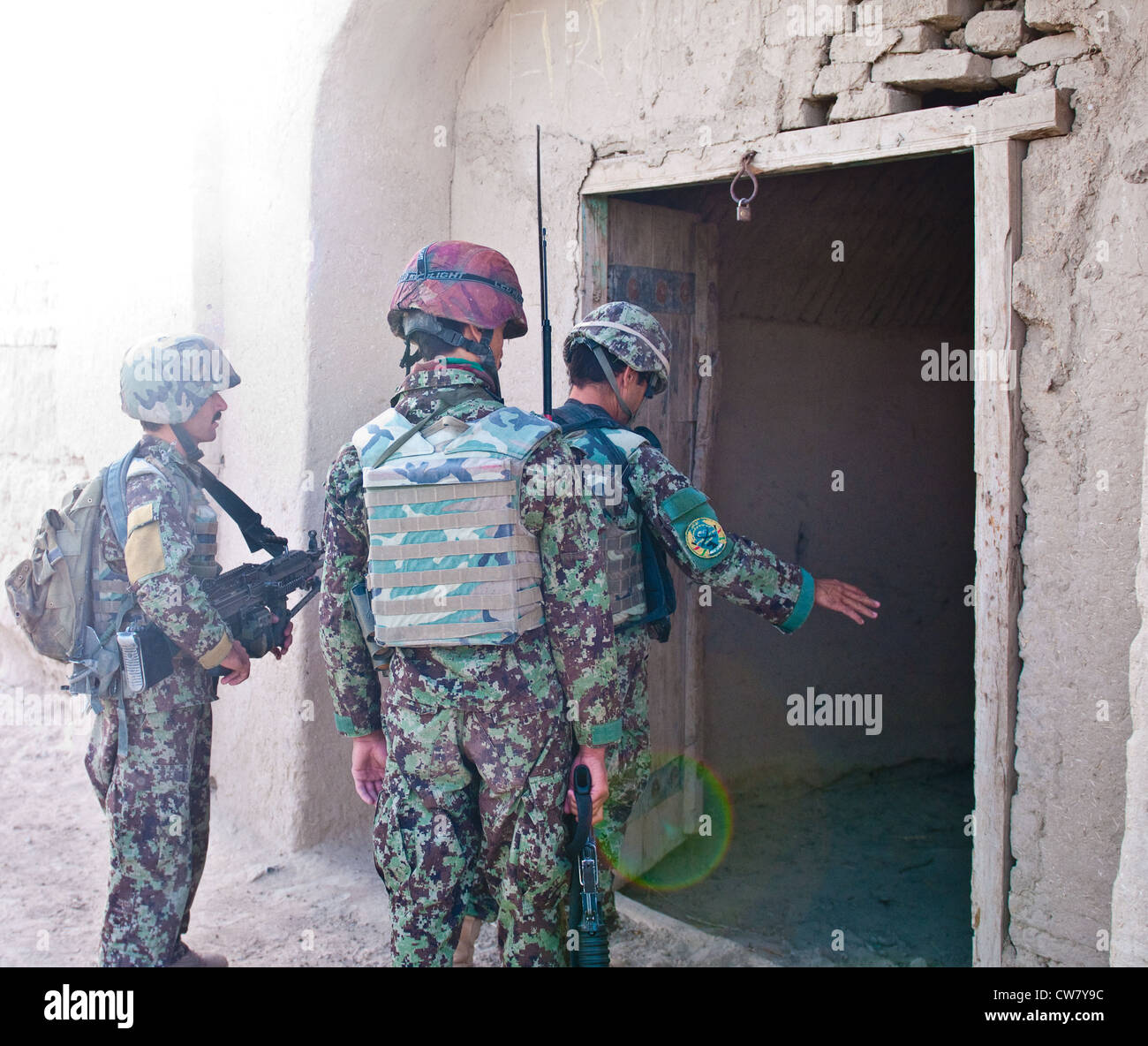 Afghan National Army soldiers prepare to search a compound while on a ...
