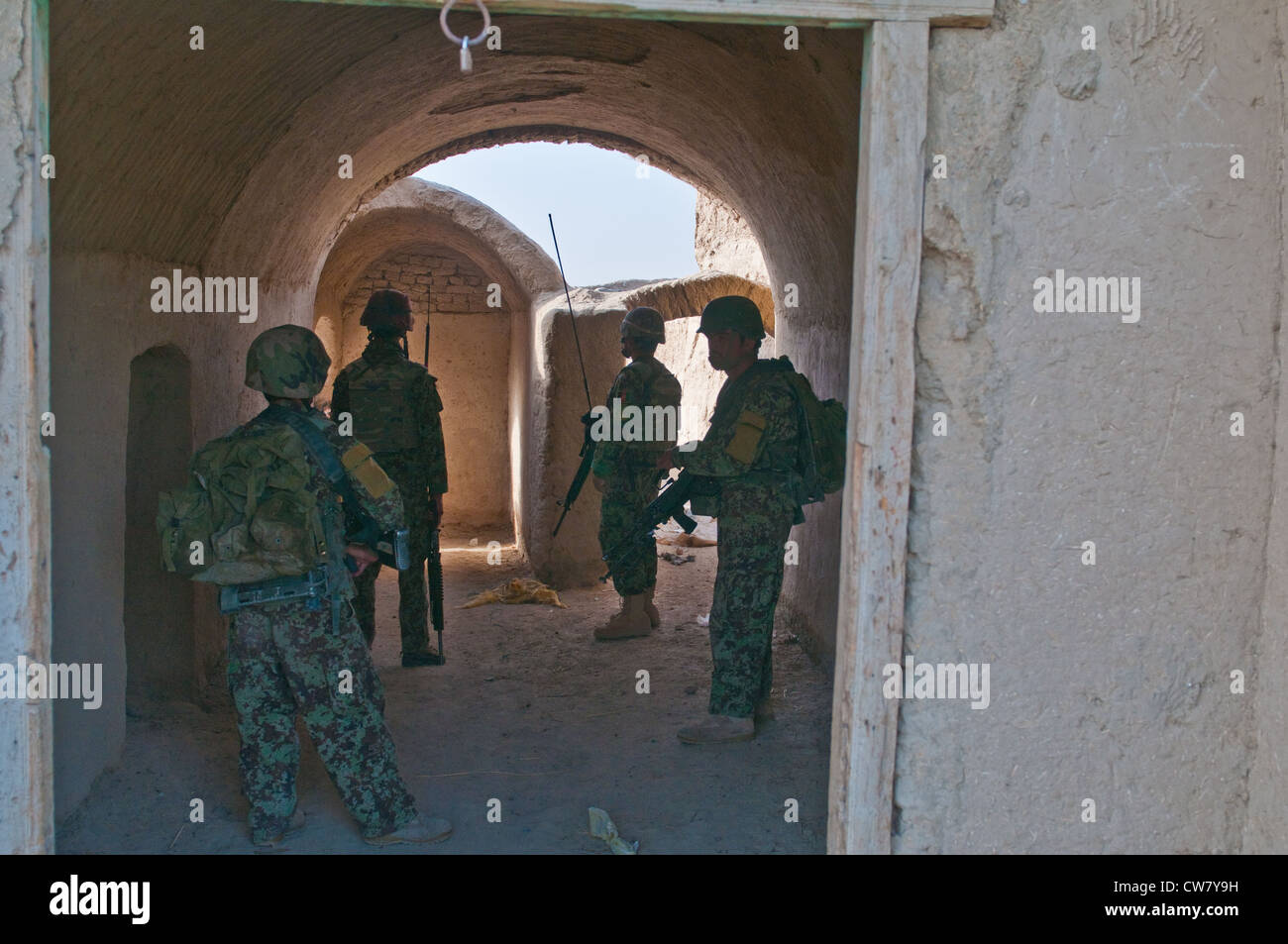 Afghan National Army soldiers search a compound while on a joint foot ...