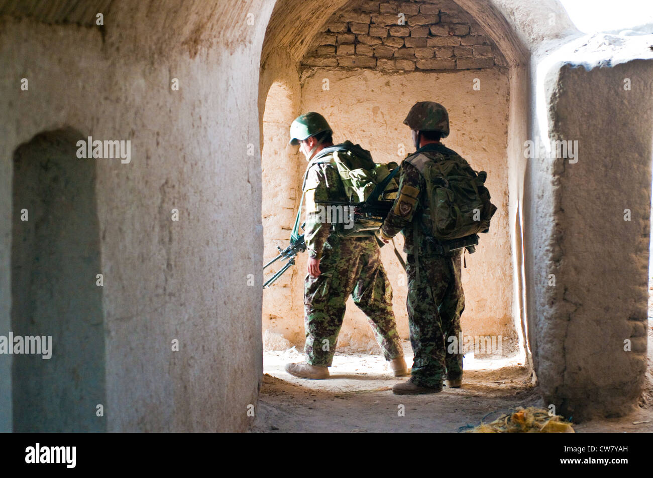 Afghan National Army soldiers search a compound while on a joint foot ...