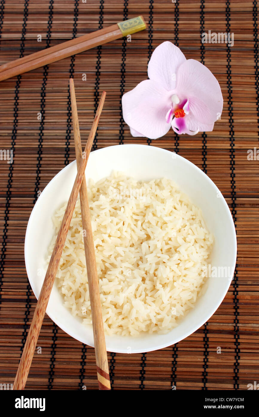 Bowl of rice with chopsticks Stock Photo - Alamy