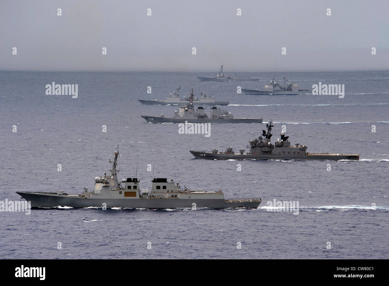 A formation of ships from the U.S. Navy, U.S. Coast Guard, Japan ...