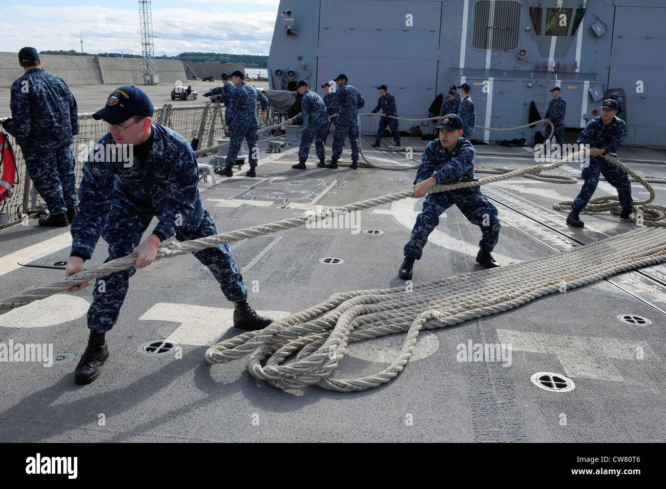 Sailors aboard the guided-missile destroyer USS Farragut (DDG 99 ...