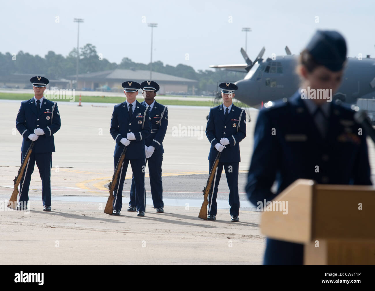 U.S. Air Force Honor Guard members stand by while Capt. Erin Richardson ...