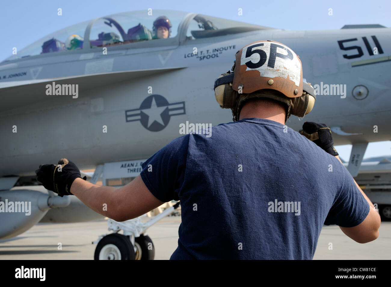 A U.S. Navy sailor assigned to the Electric Attack Squadron 138th from ...