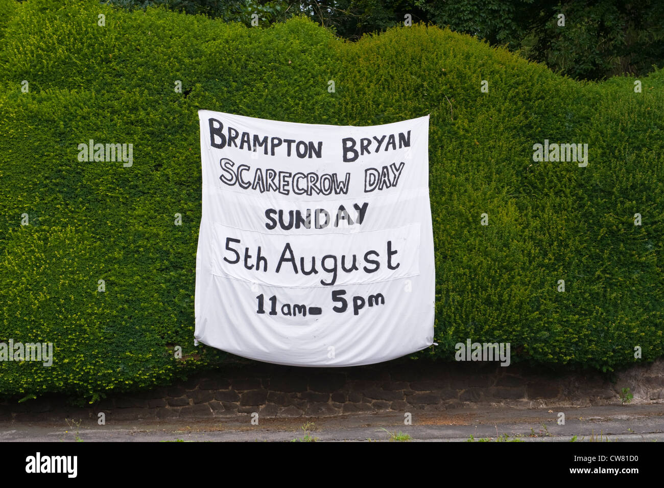 Roadside sign for Scarecrow Day at village fete in village of Brampton ...