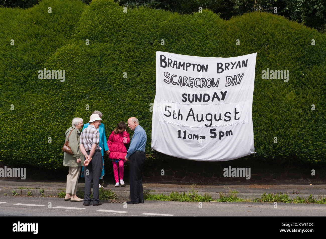 Roadside sign for Scarecrow Day at village fete in village of Brampton ...