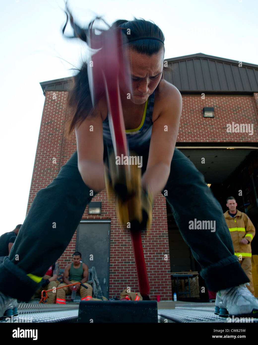 Staff Sgt. Kira Enlow, 633rd Civil Engineer Squadron fire fighter, uses ...