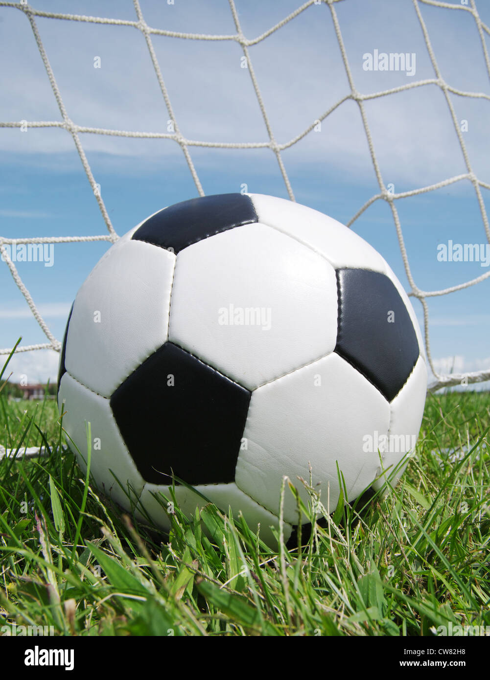 Classic football in the goal net Stock Photo - Alamy