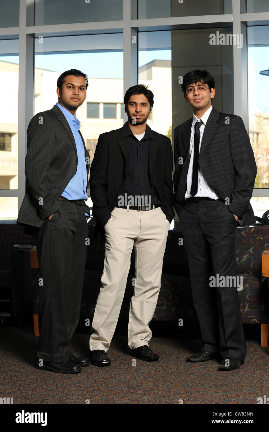 Group of Businessmen standing up inside an office building Stock Photo ...