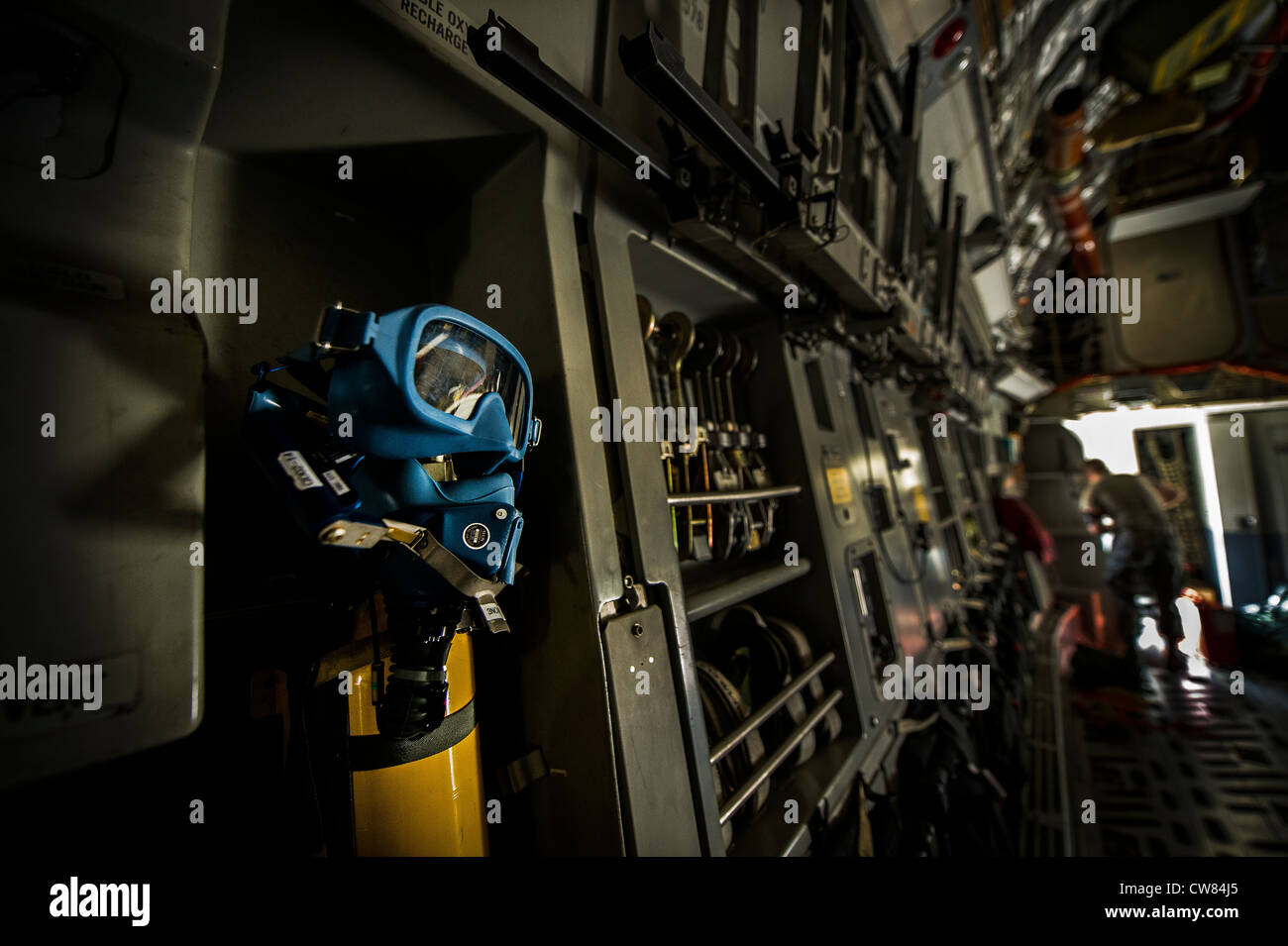 A recently replaced Quick Don Mask sits at the ready on a C-17 ...