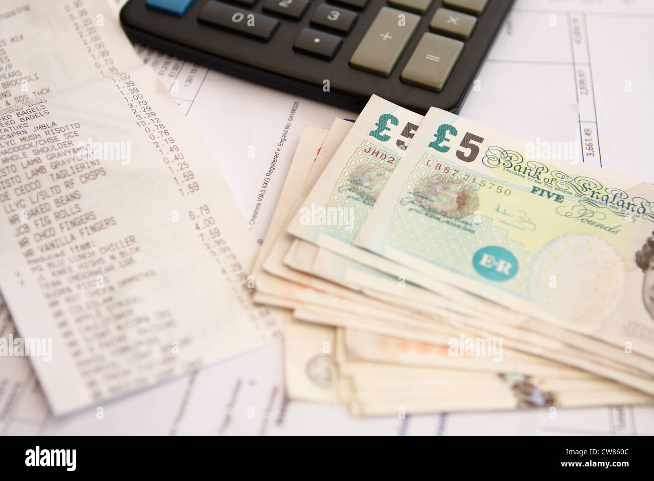 sterling notes, bills and part of a calculator Stock Photo - Alamy