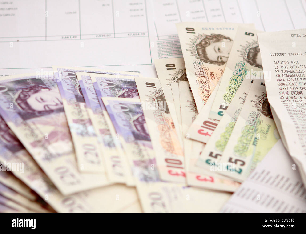 sterling notes lying on receipts and invoices Stock Photo - Alamy