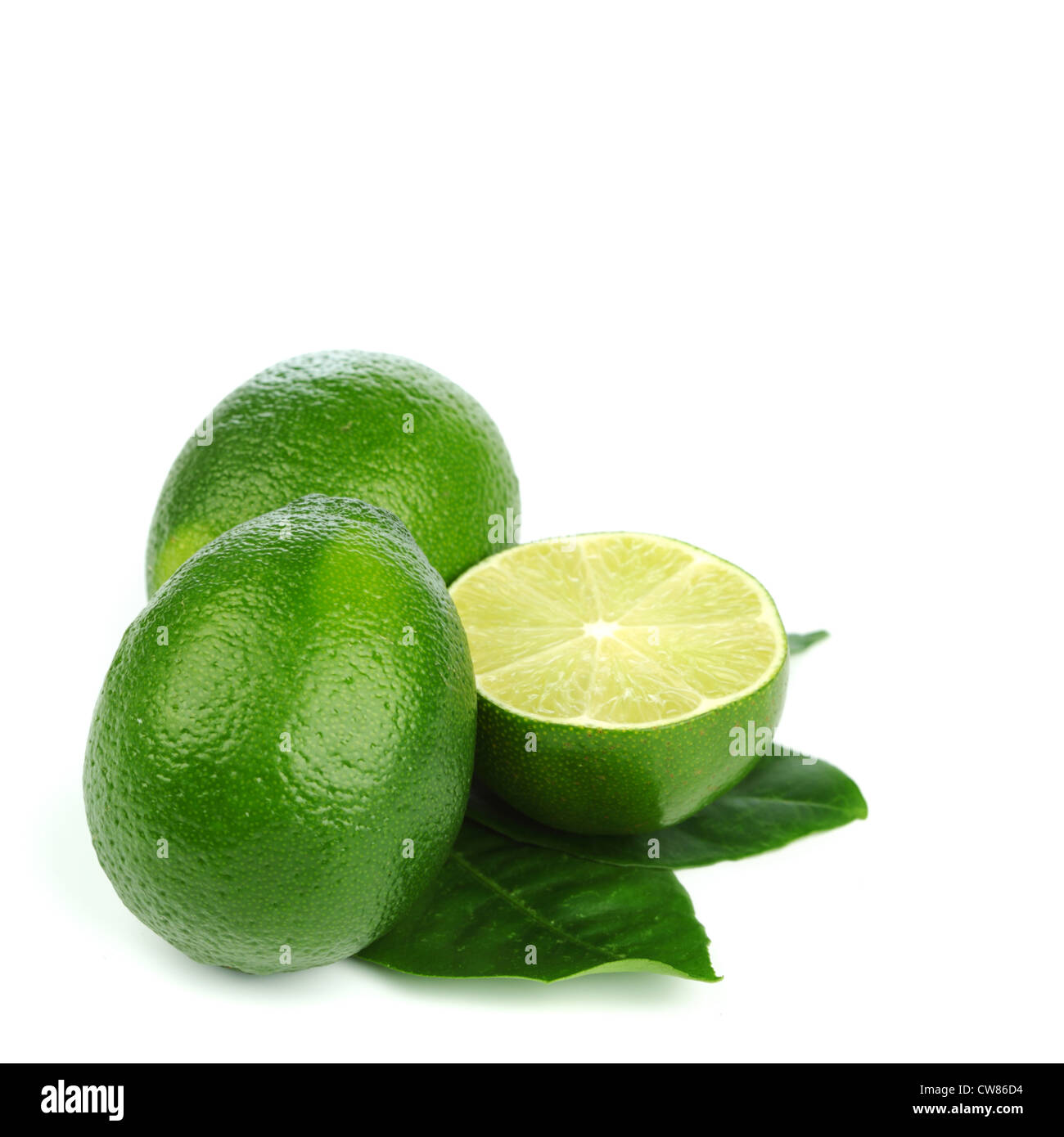 Three organic limes isolated on white hi-res stock photography and ...