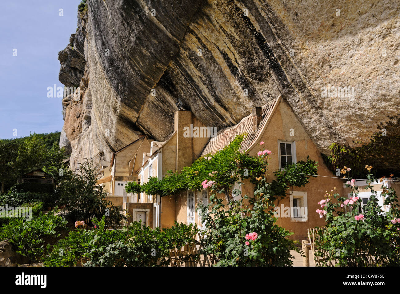 Cave house carved into the rock face of a cliff, Grotte du Grand Roc ...