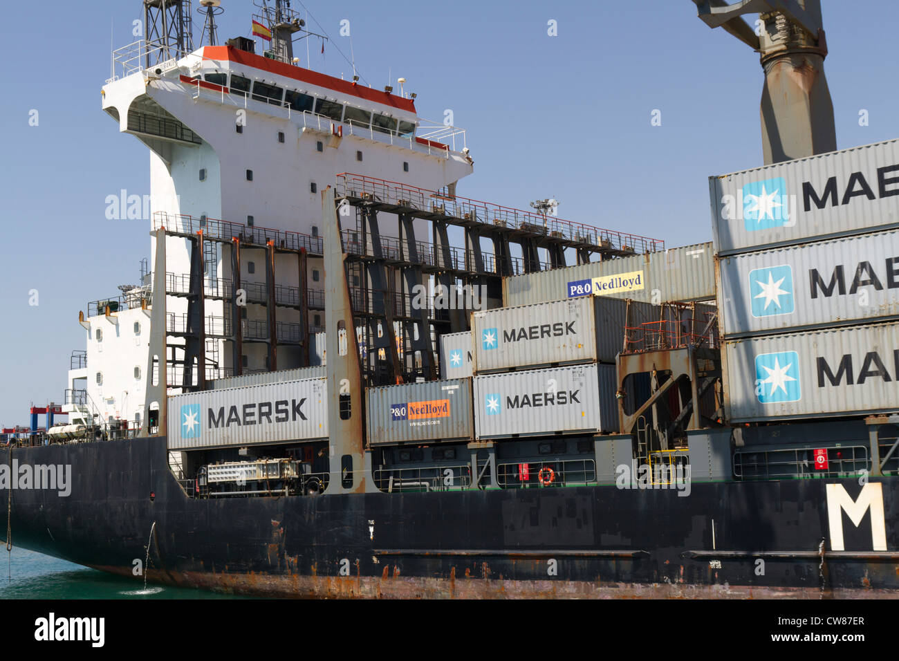 Large container ships being loaded and unloaded in Malaga Port Spain ...