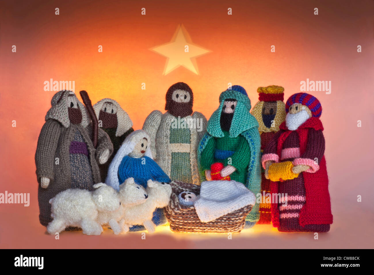 Knitted nativity scene depicting the birth of Jesus on an orange ...