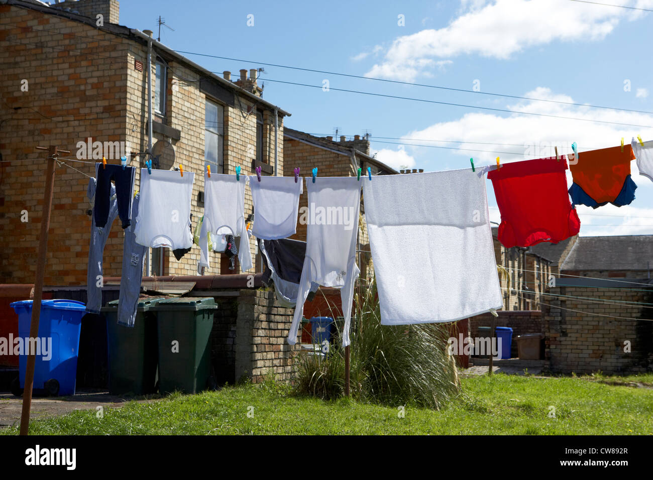 drying washing on a washing line at the rear of tenement buildings in ...