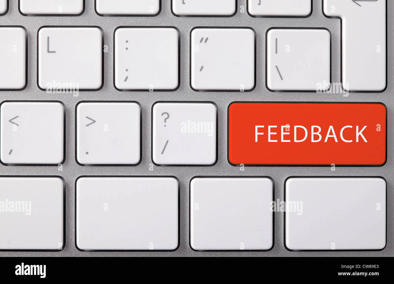 Laptop keyboard and red key "FEEDBACK" on it Stock Photo - Alamy