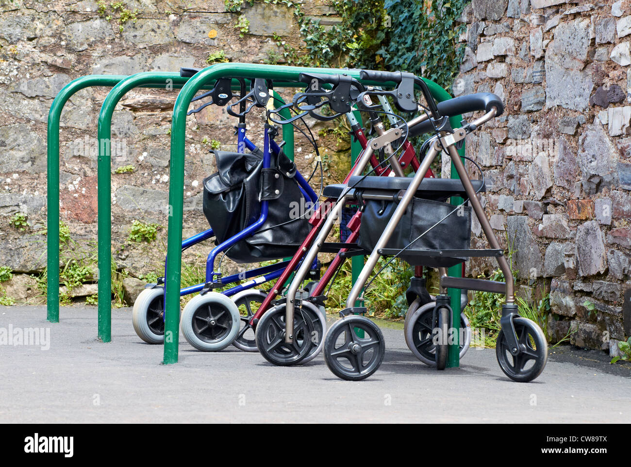 Disability walking frames for the elderly parked and chained to a bike ...