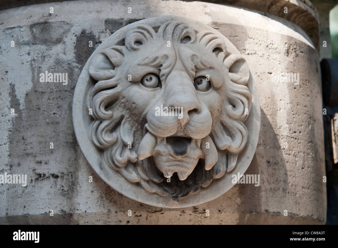 A lion face adorns a column in front of the Palazzo Baberini in Rome ...