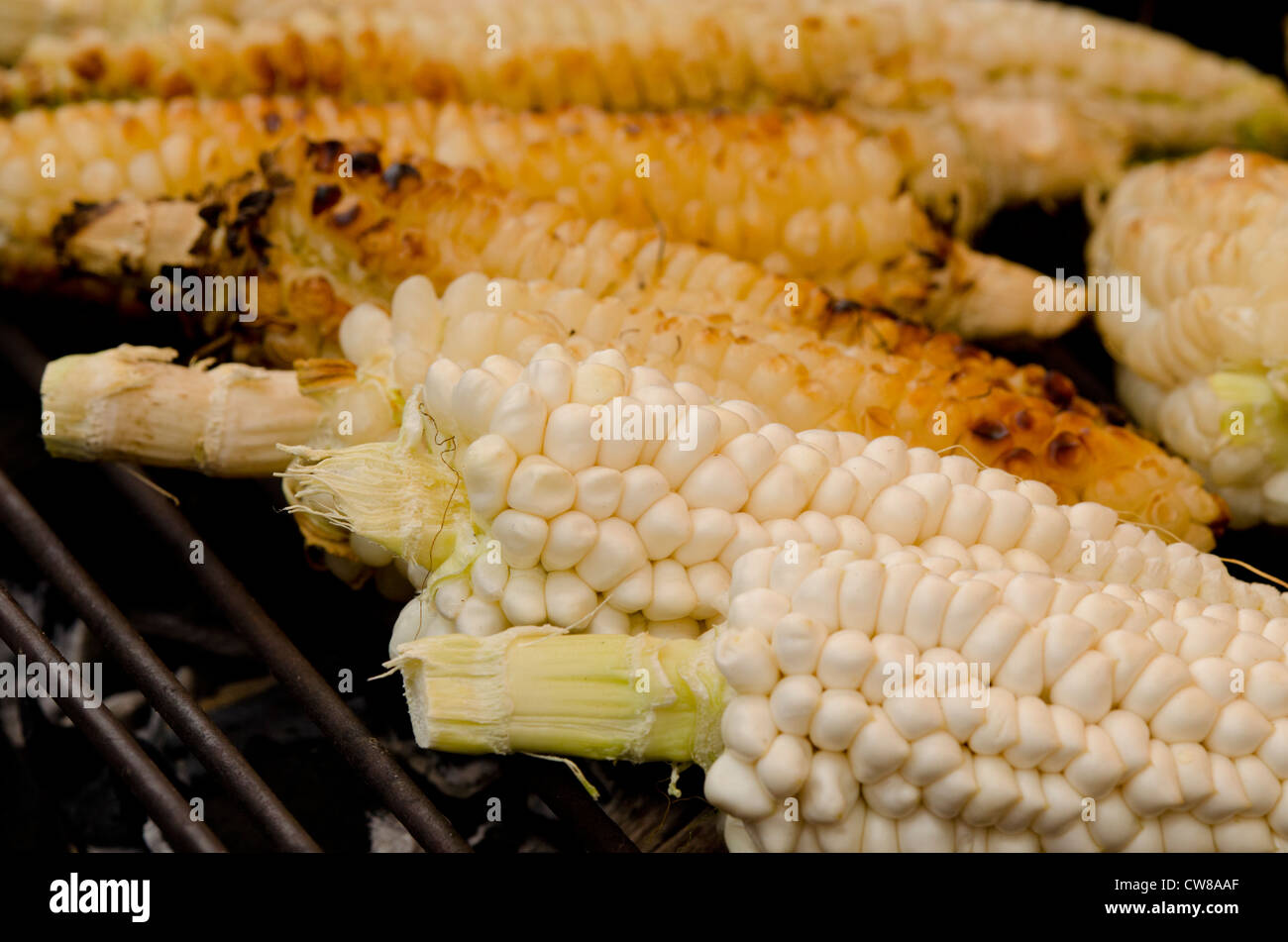 Ecuador, Quito area. Otavalo Market. Local corn on the cob roasting on ...