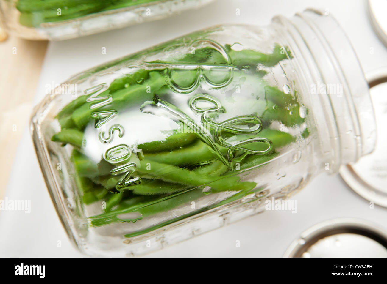string beans being packed in jars for home canning Stock Photo - Alamy
