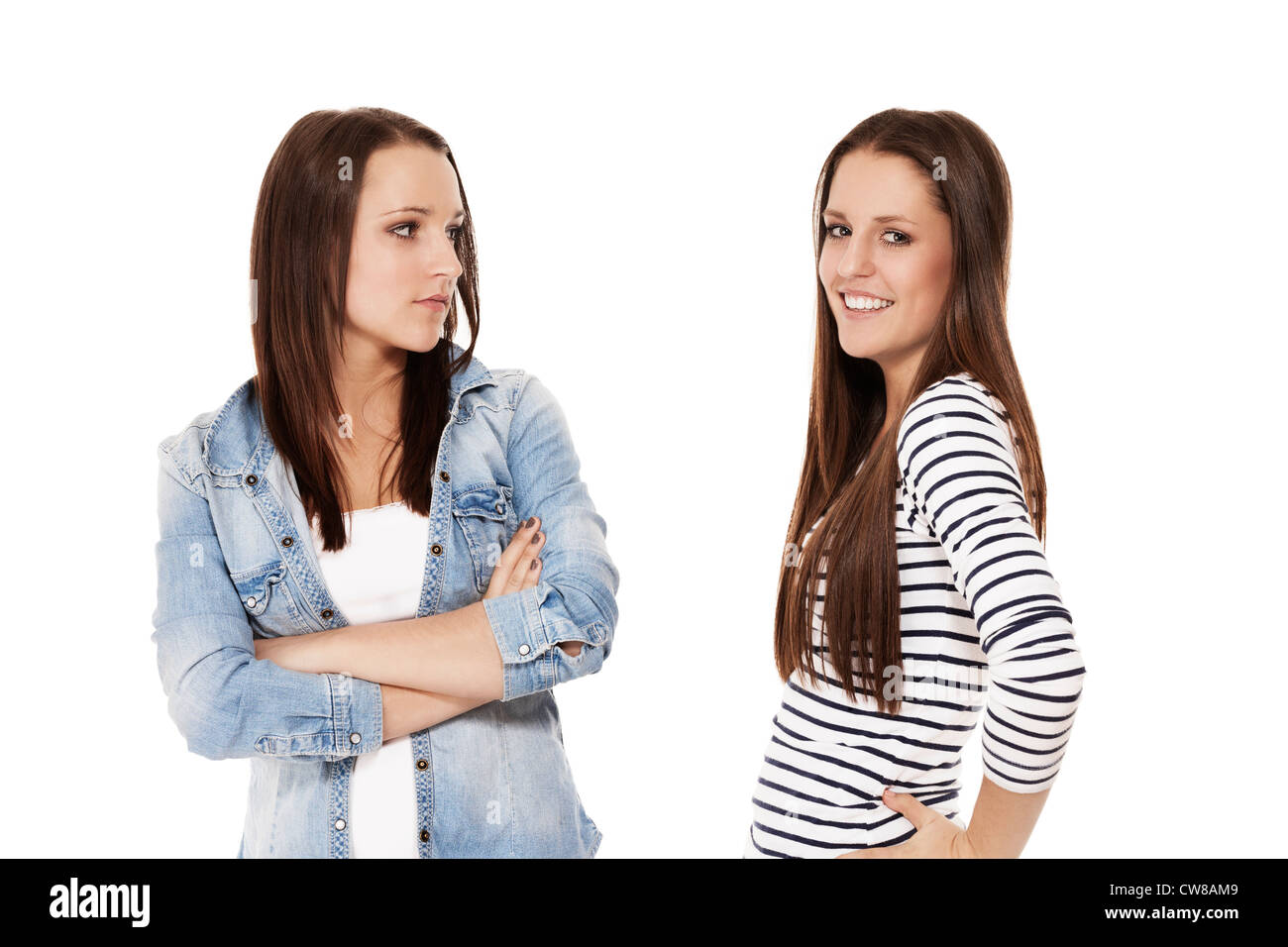 one happy and one upset teenager on white background Stock Photo - Alamy