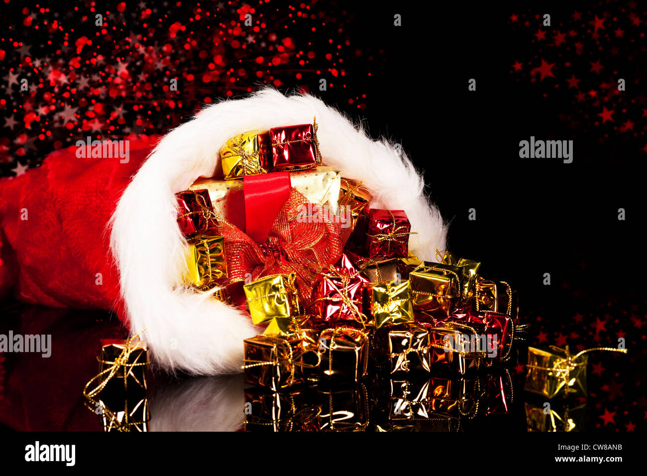 christmas presents falling from santa's hat on black background Stock ... christmas presents falling from santa's hat on black background Stock ...
