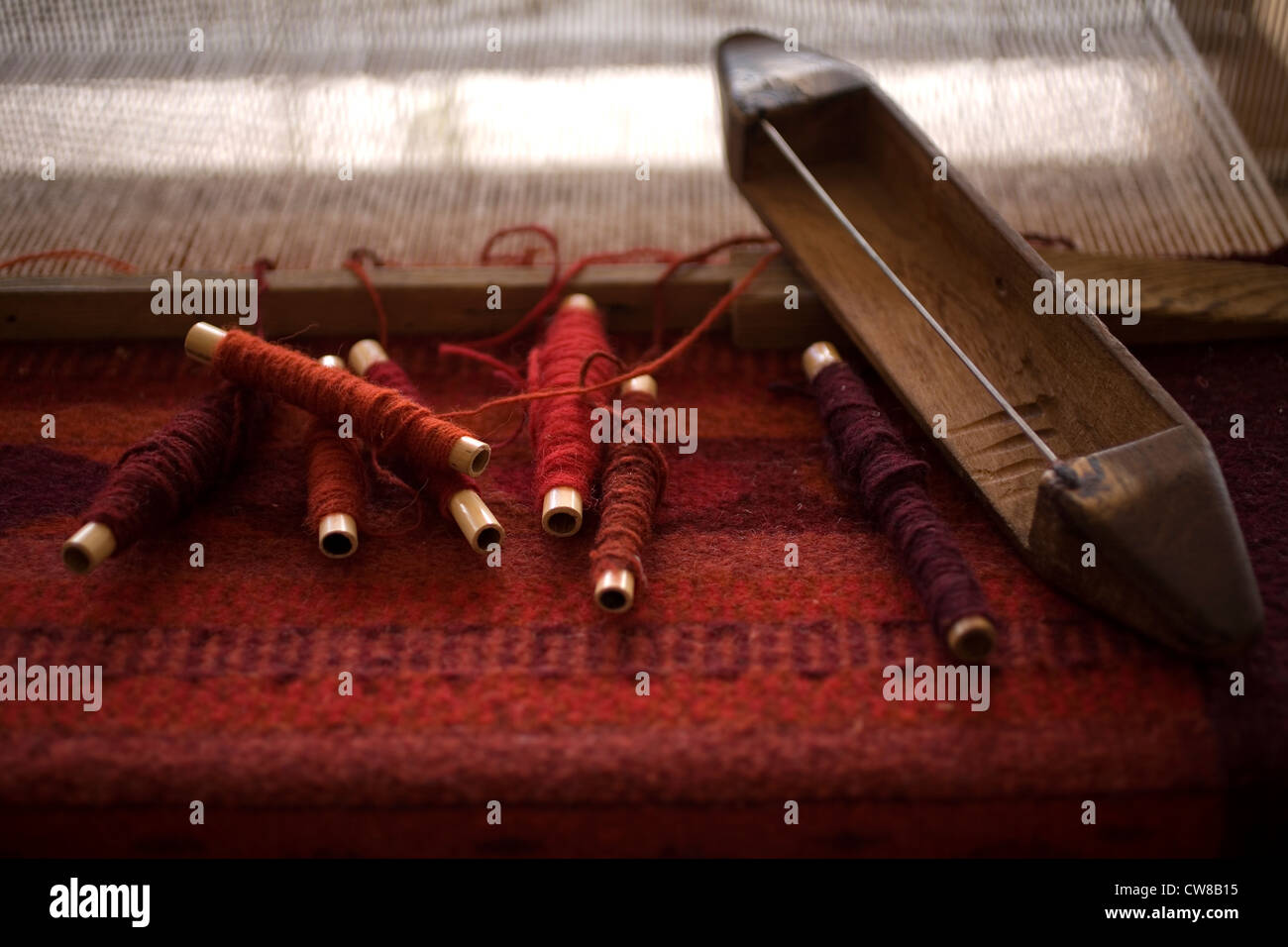 Red wool spools in a weaving studio in Teotitlan del Valle, Oaxaca ...