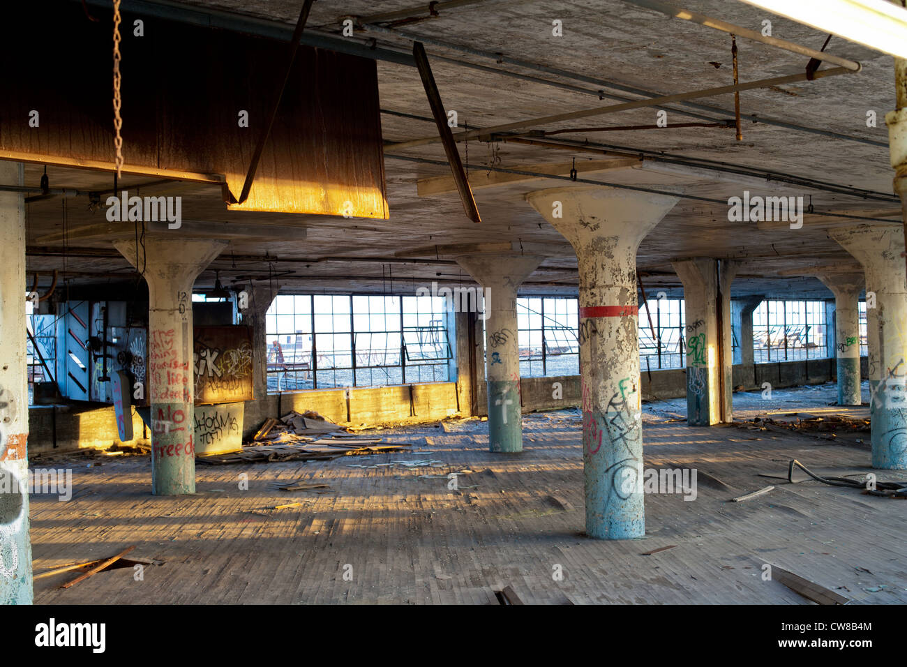 Interior of an abandoned car factory in Detroit Michigan. The windows ...