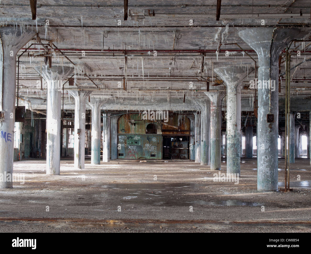 Interior of an abandoned car factory in Detroit Michigan. The windows ...