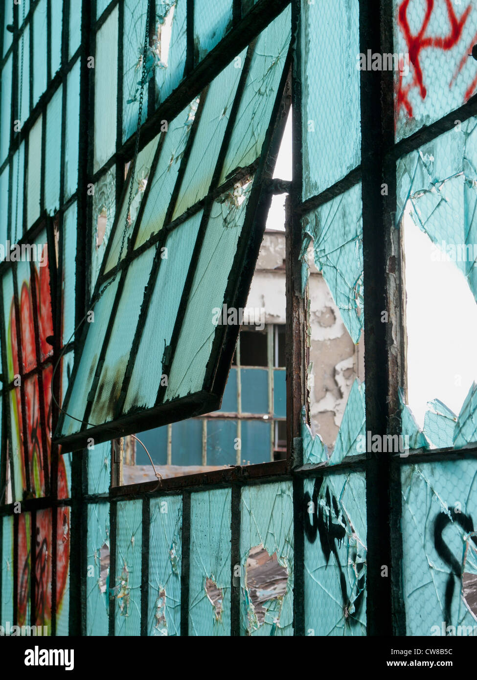 Interior of an abandoned car factory in Detroit Michigan. The windows ...