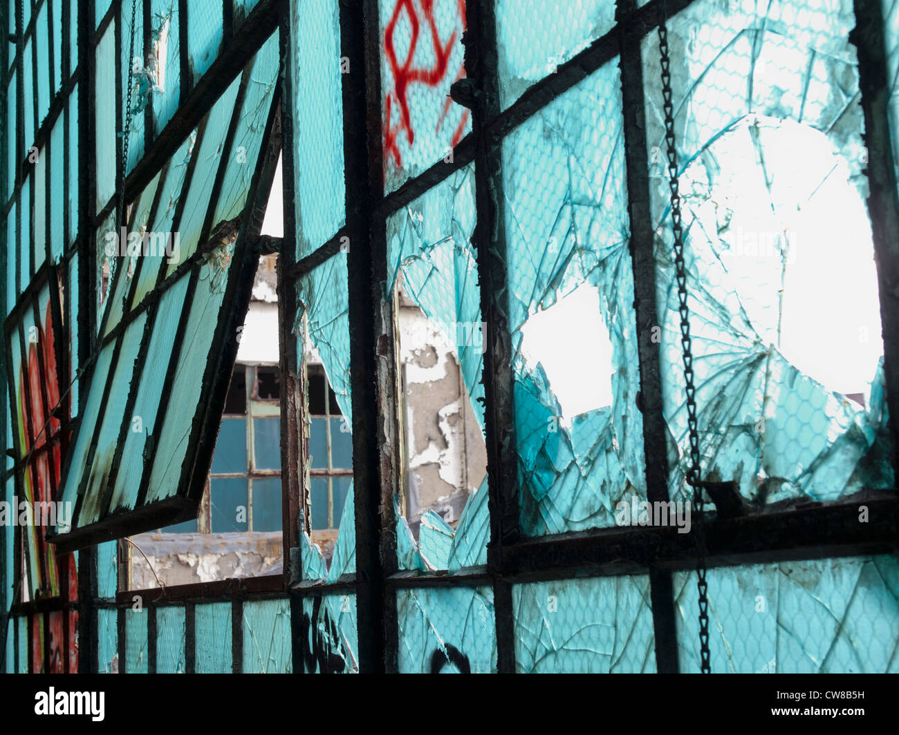 Interior of an abandoned car factory in Detroit Michigan. The windows ...