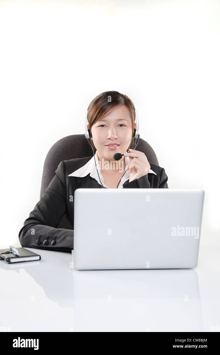 Female service agent with headset Stock Photo - Alamy