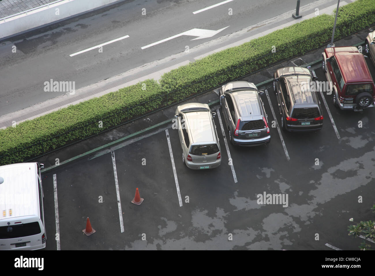 It's a photo view from the top of the street. We can see a parking ...