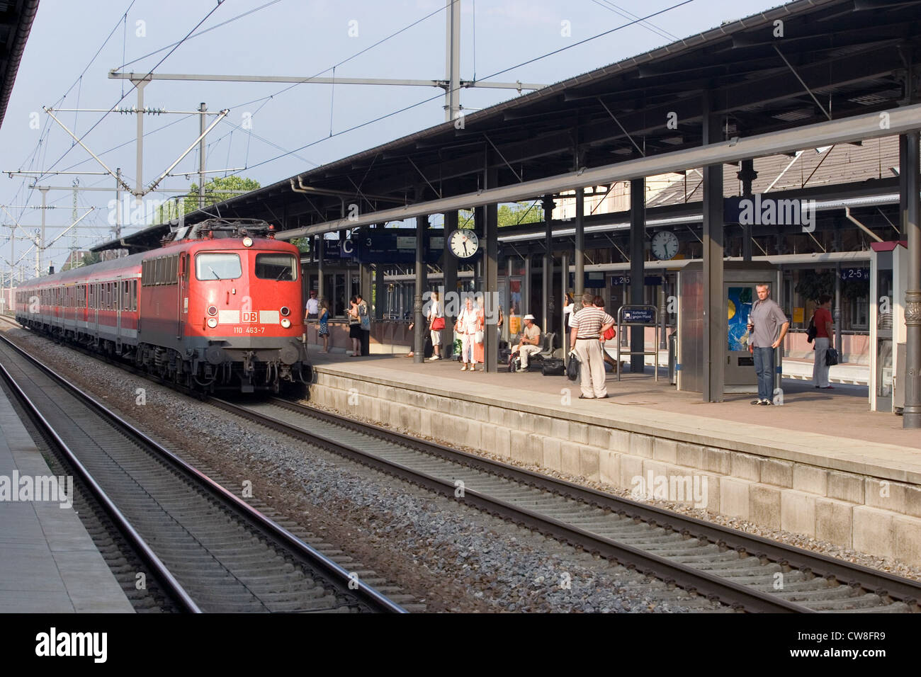 Baden-Baden, travelers wait at the station for the arrival of the train ...