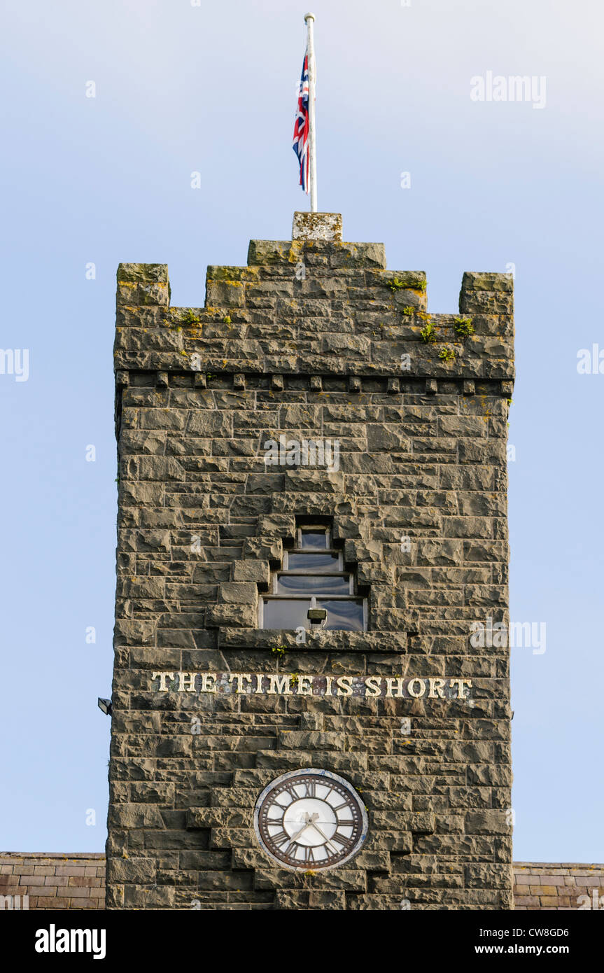 Clock tower with motto "The Time is Short Stock Photo - Alamy